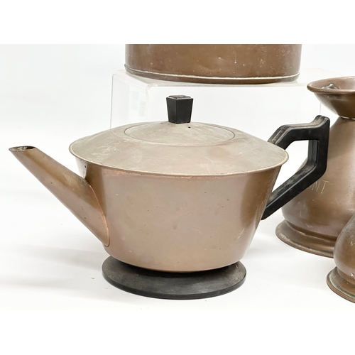 A collection of Late 19th Century copper measures and kettles. Imperial ...