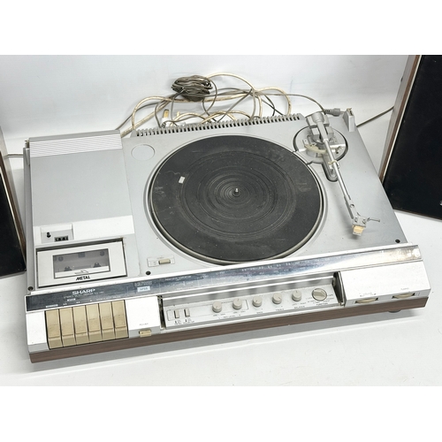 A Sharp SG-280E Stereo Music Center with speakers.