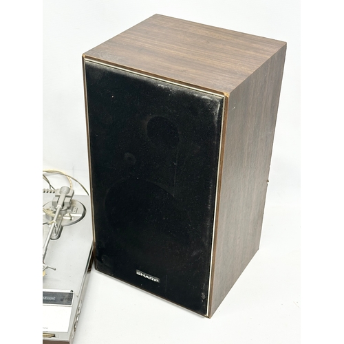 A Sharp SG-280E Stereo Music Center with speakers.