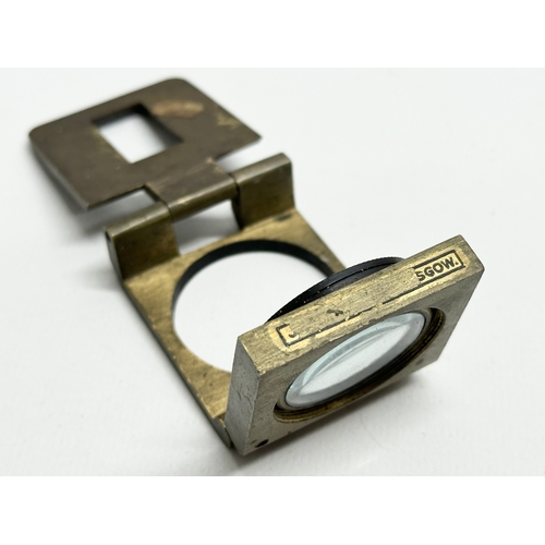 A Scottish brass thread counter magnifying glass.