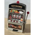 A Bandit slot machine money bank. 20x15x37cm