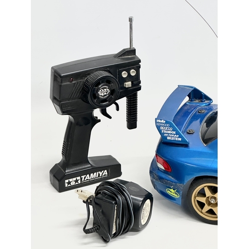A Tamiya remote control Subaru. 44cm