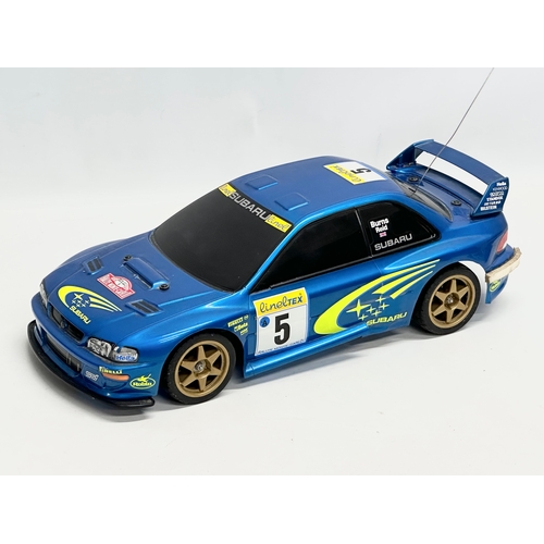 A Tamiya remote control Subaru. 44cm