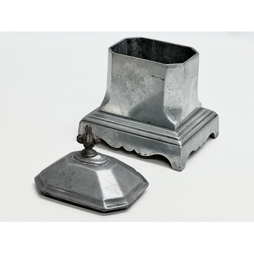 A 19th Century lead tobacco jar/tea caddy. 12.5x9.5x18cm.
