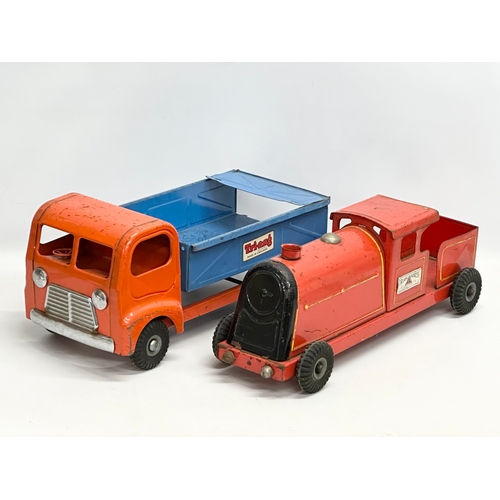 Two large vintage Tri-ang tinplate toys. A Tri-ang Express locomotive ...