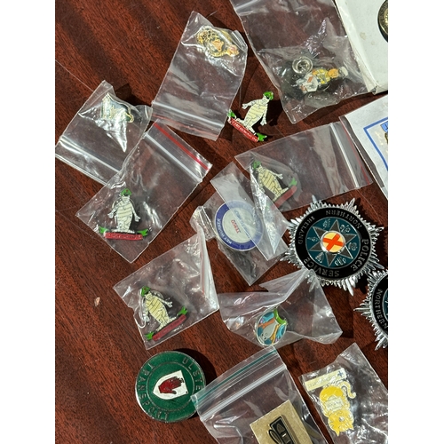 A collection of badges.