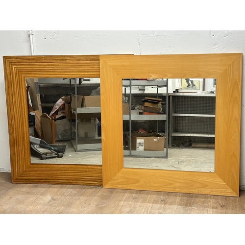 A pair of very large beech framed mirrors. 120x120cm