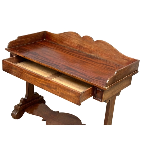 A 19th Century, Early Victorian mahogany gallery back side table with ...