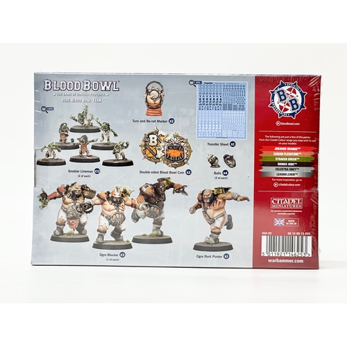 An unopened Warhammer Blood Bowl Ogre Blood Bowl Team. The Fire ...