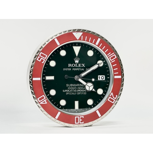 A Rolex Oyster Perpetual Date Submariner wall clock. 34cm