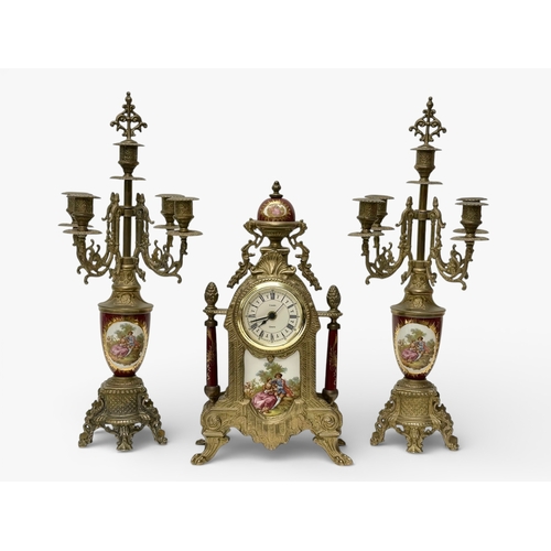 An 18th Century style three piece brass mantel clock set. Uranio, Italy ...