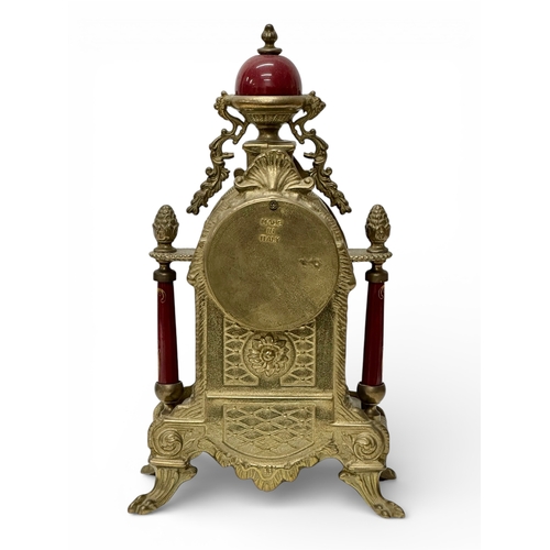 An 18th Century style three piece brass mantel clock set. Uranio, Italy ...