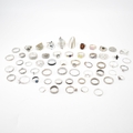 A large collection of white metal rings. The lot to include; white ...