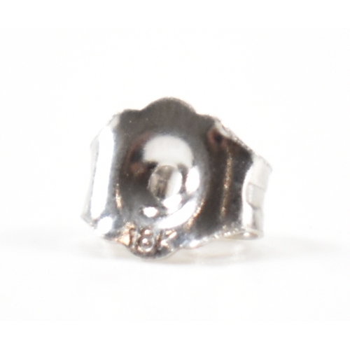 A pair of 18ct gold and diamond stud earrings. Each earring being prong ...