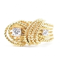 A vintage gold and diamond knot ring. The rope design ring being set ...