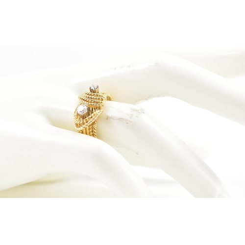 A vintage gold and diamond knot ring. The rope design ring being set ...