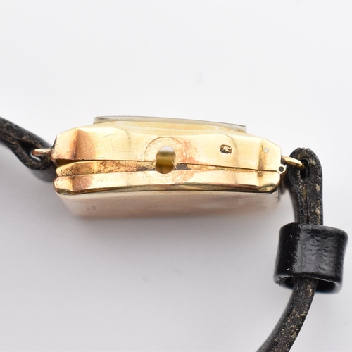 Two yellow gold wrist watches with leatherette straps. The first a ...