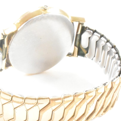 A vintage Omega gold tone wristwatch. The watch having a circular ...