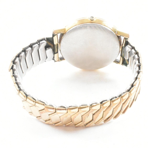 A vintage Omega gold tone wristwatch. The watch having a circular ...