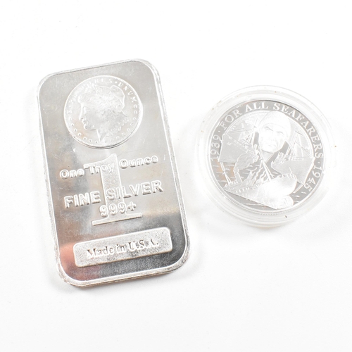 A cased 2016 Gibraltar twenty pound coin and a fine silver ingot. The ...