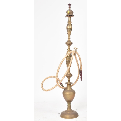 A large vintage 20th century Middle Eastern brass hookah pipe. The pipe ...