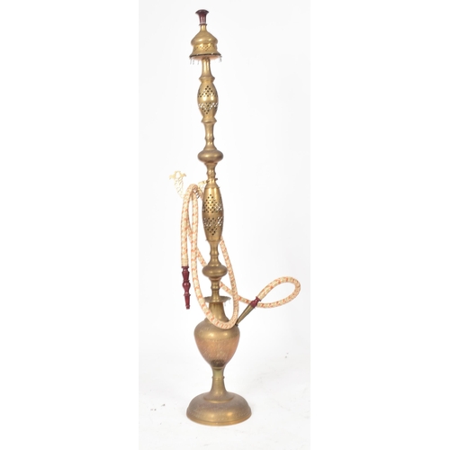 A large vintage 20th century Middle Eastern brass hookah pipe. The pipe ...