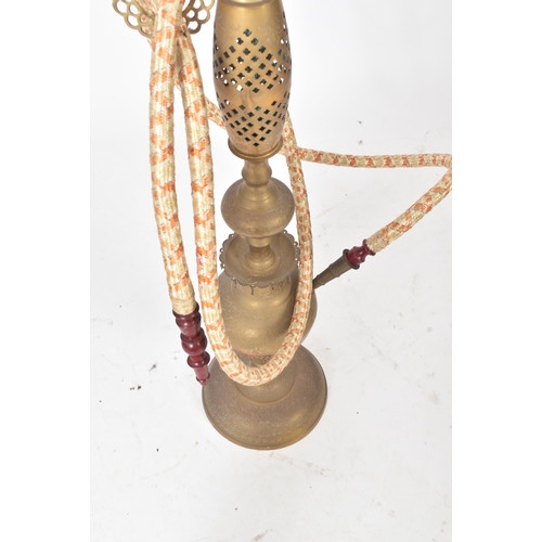 A large vintage 20th century Middle Eastern brass hookah pipe. The pipe ...