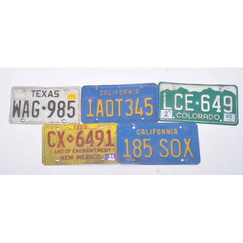 A mixed selection of vintage American car number plates. The plates of ...