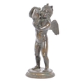 A late 19th century bronze statue of Cupid carrying a dolphin. Italian ...