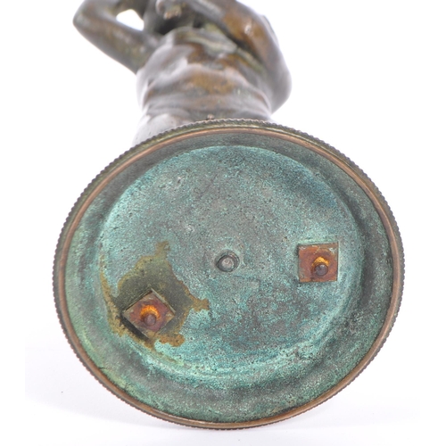 A late 19th century bronze statue of Cupid carrying a dolphin. Italian ...