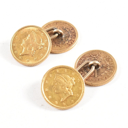 A pair of yellow metal 1 Dollar coin cufflinks. The cufflinks having ...