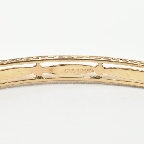 An antique 9ct yellow gold bangle armlet. The cuff arm band of faceted ...