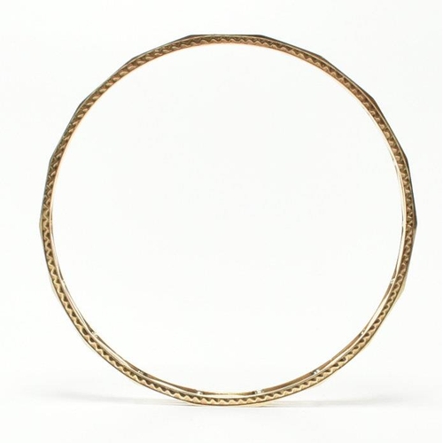 An antique 9ct yellow gold bangle armlet. The cuff arm band of faceted ...
