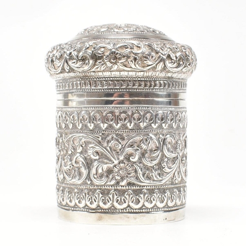 An early 20th century Indian white metal cannister. The lidded jar ...
