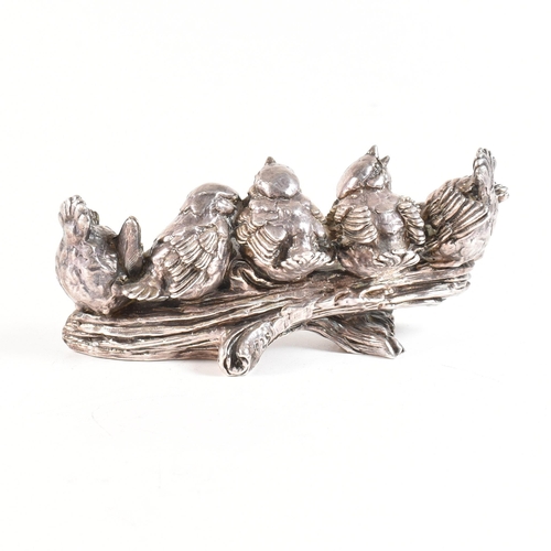A 925 silver mounted model of five birds perched on a log along with a ...