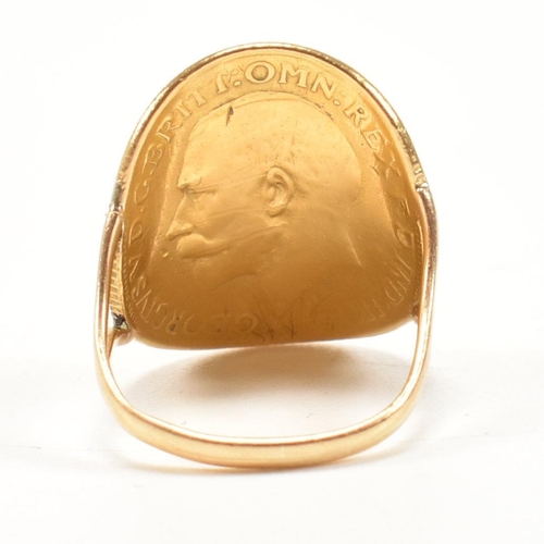 An 18ct gold mounted George V sovereign ring. The ring having a full ...