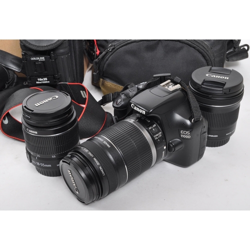 A collection of 20th century cameras and related accessories and ...