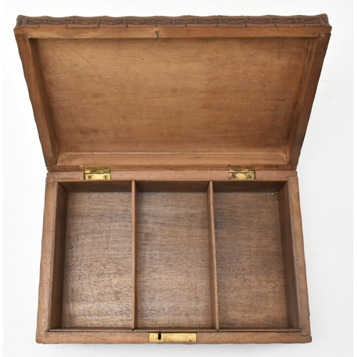 A Chinese 20th century hand carved wood dragon cigar box. The box ...