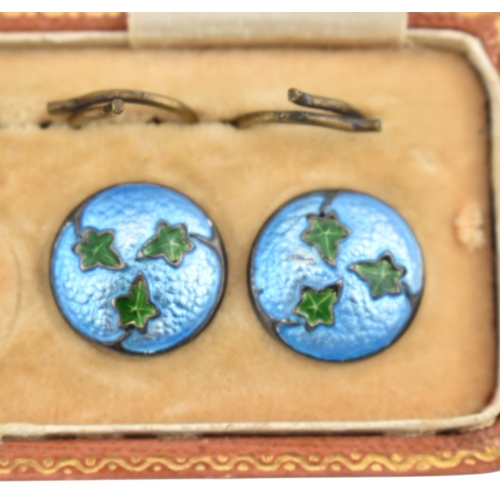 A cased set of sterling silver enamel buttons decorated with ivy leaves ...